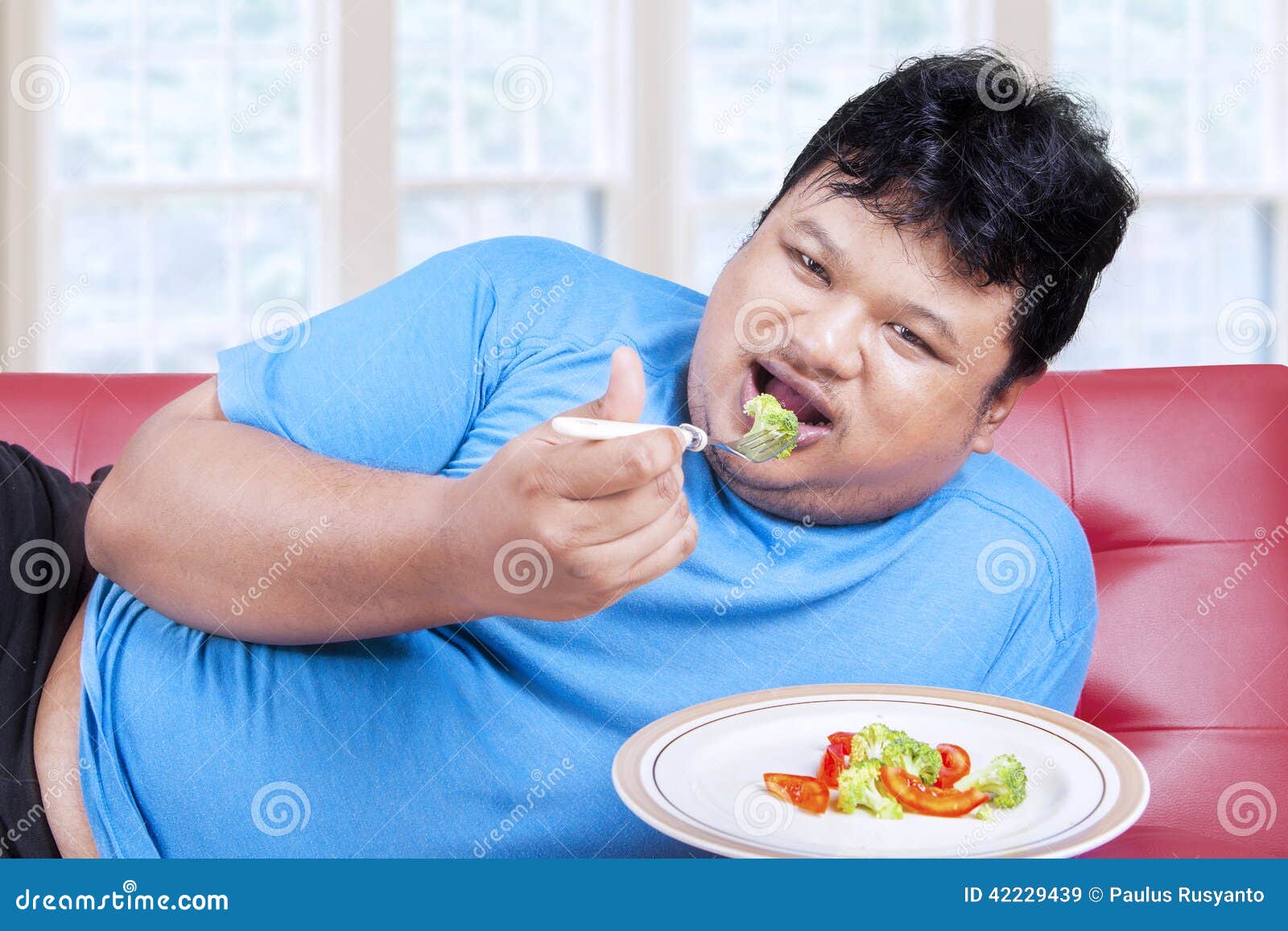 Man Try To Diet by Eating Vegetable 1 Stock Image - Image of happy ...