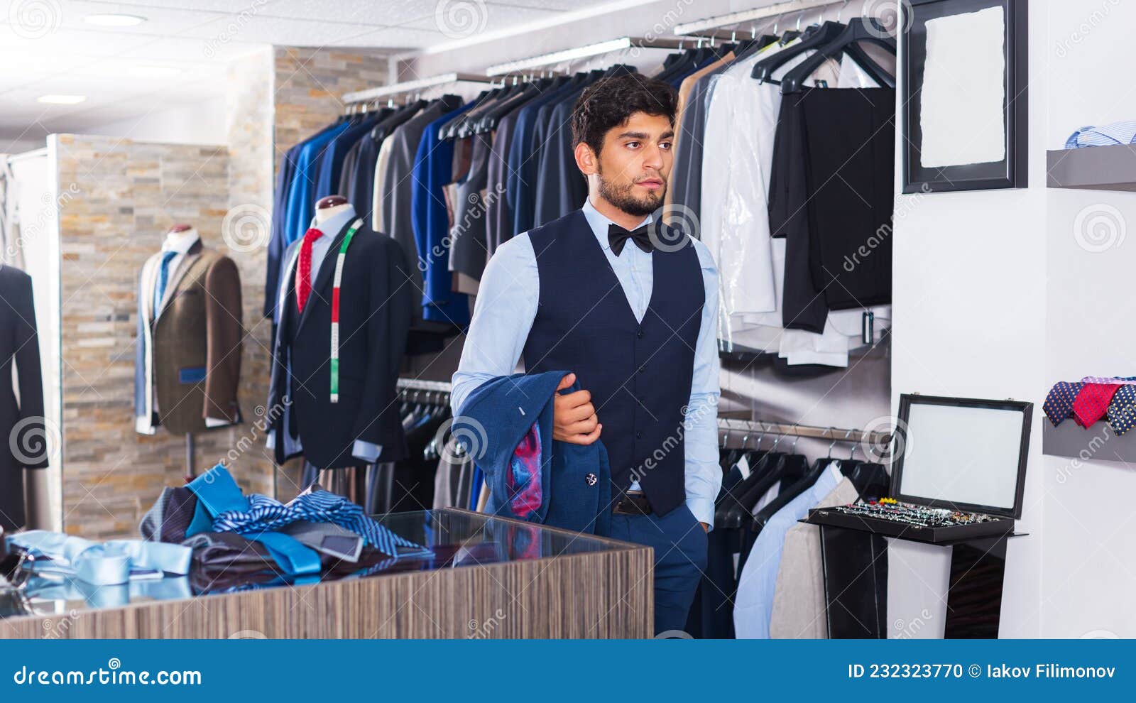 Man trying on jacket stock photo. Image of caucasian - 232323770