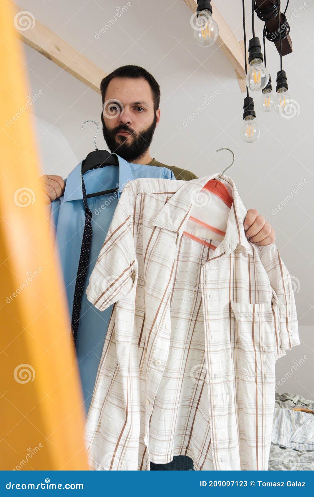 Man Trying on Smart Shirts Against a Mirror Stock Image - Image of ...
