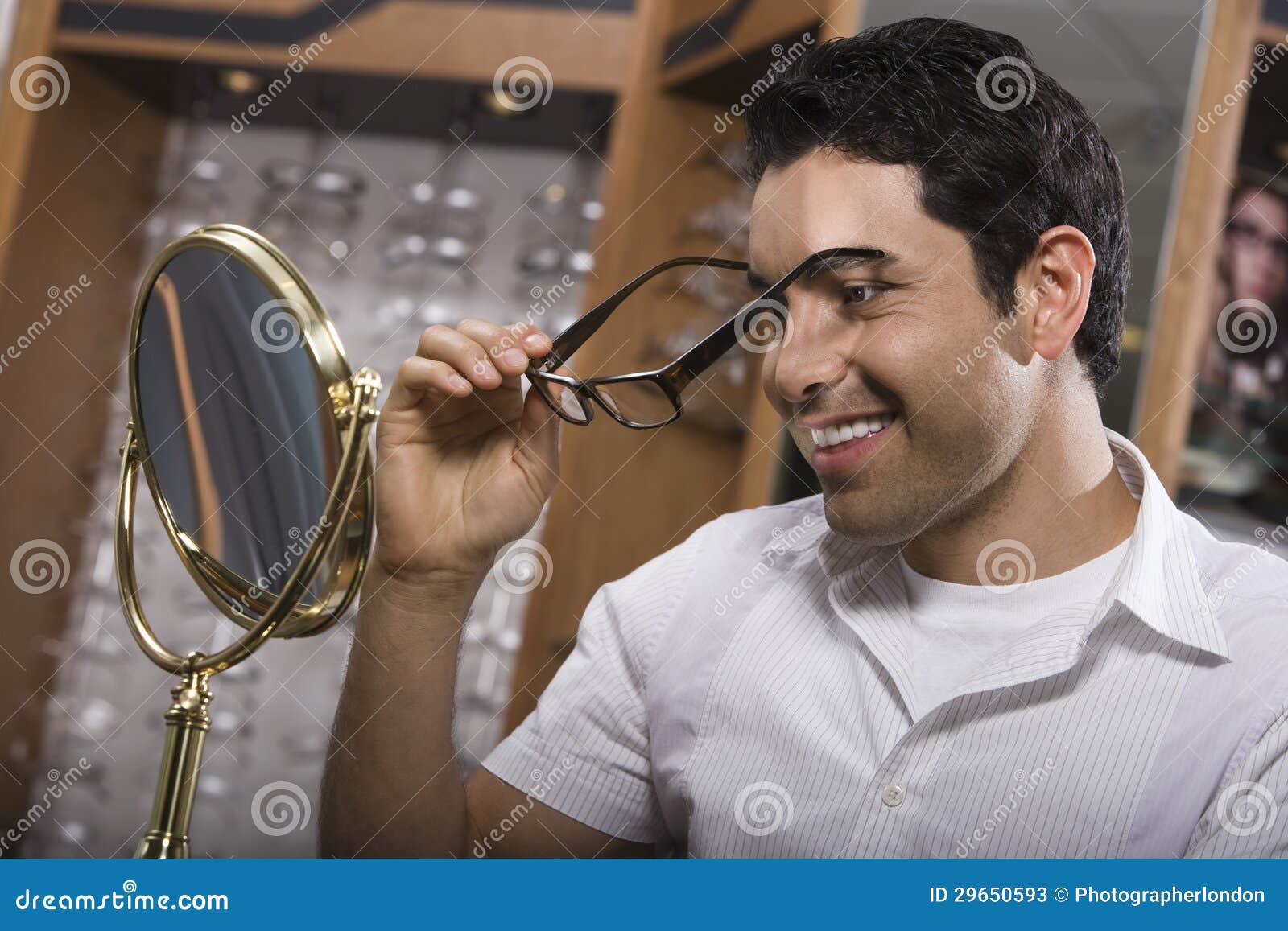 Man Trying on Spectacles stock image. Image of foreground - 29650593