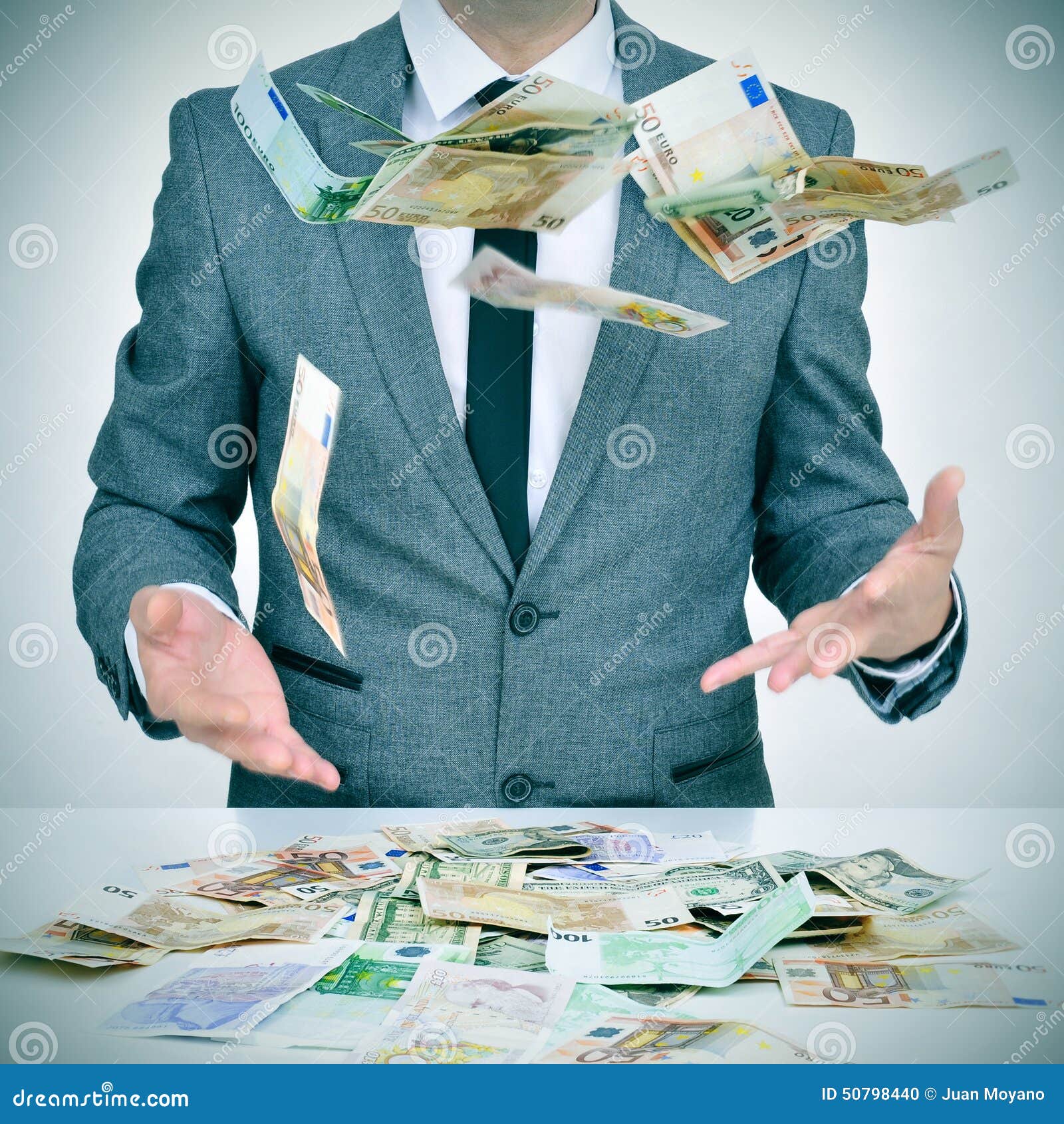 Man Trying To Catch Money Falling from the Sky Stock Photo - Image of ...