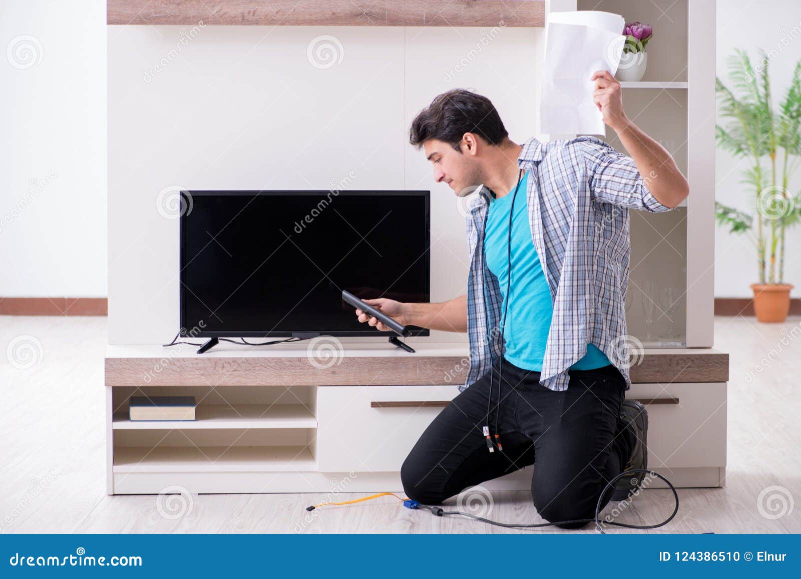 The Man Trying To Fix Broken Tv Stock Photo - Image of display ...