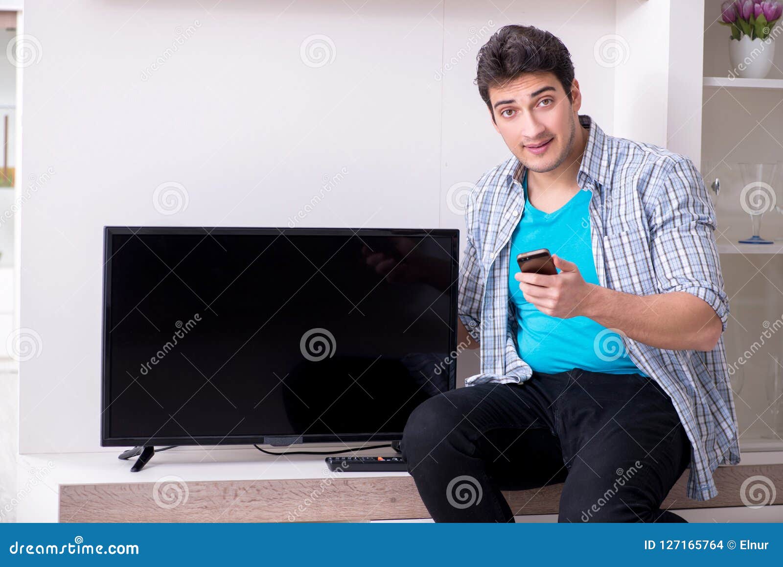 The Man Trying To Fix Broken Tv Stock Photo - Image of mobile, remote ... The Man Trying To Fix Broken Tv Stock Photo - Image of mobile, remote ...