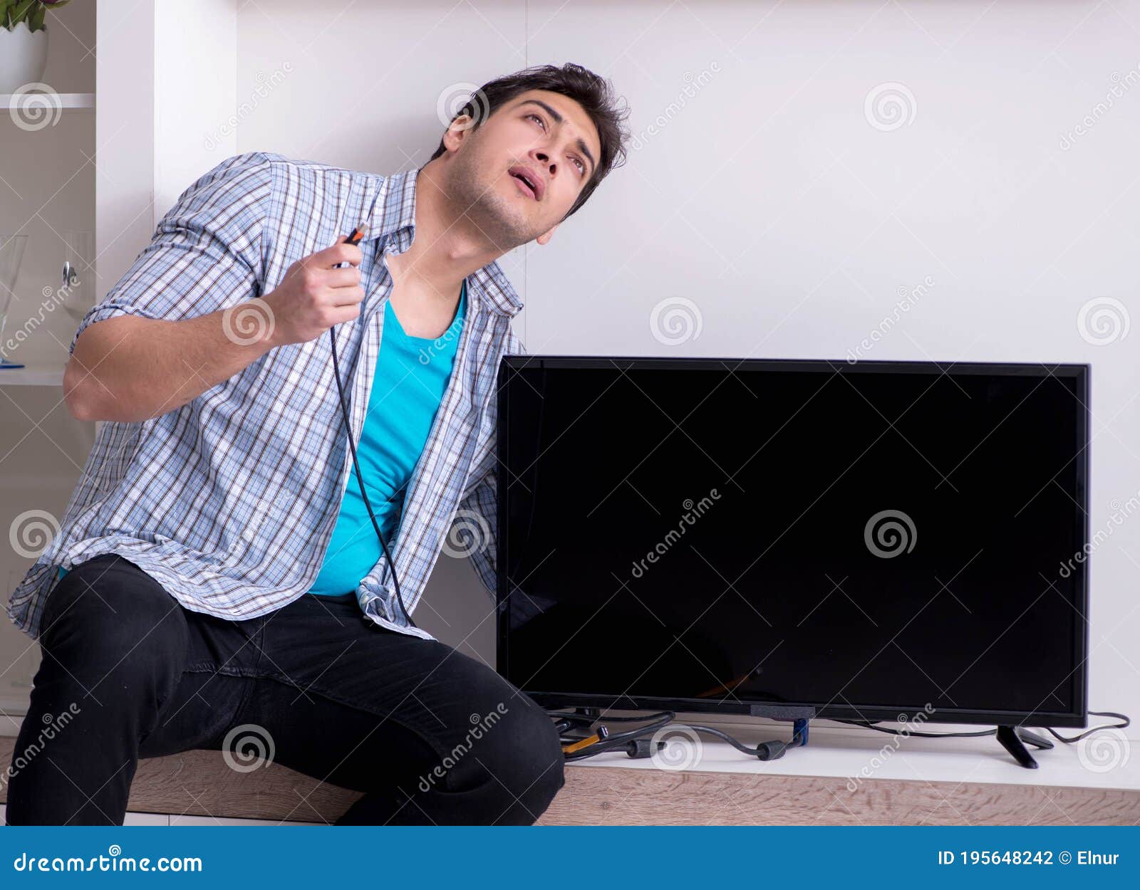 Man Trying To Fix Broken Tv Stock Photo - Image of electric ...