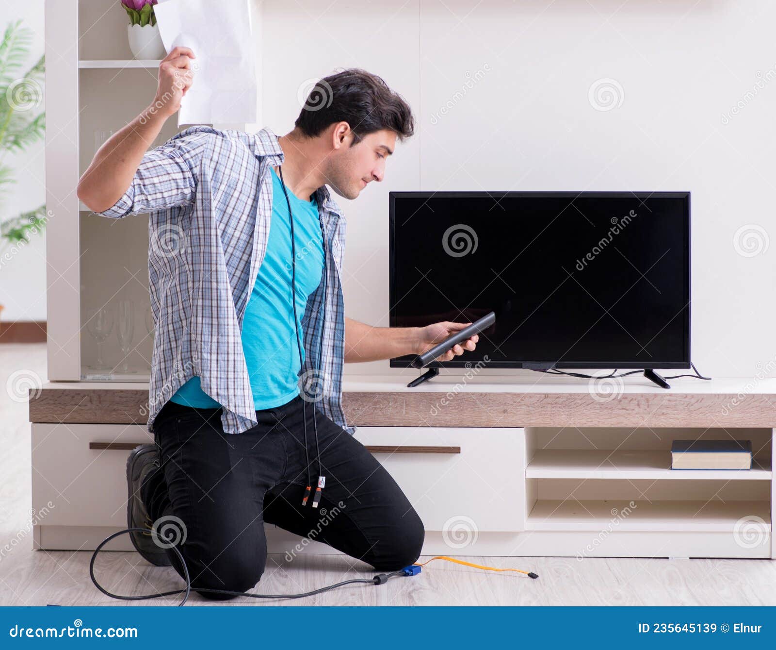 Man Trying To Fix Broken Tv Stock Image - Image of repairing, handyman ...