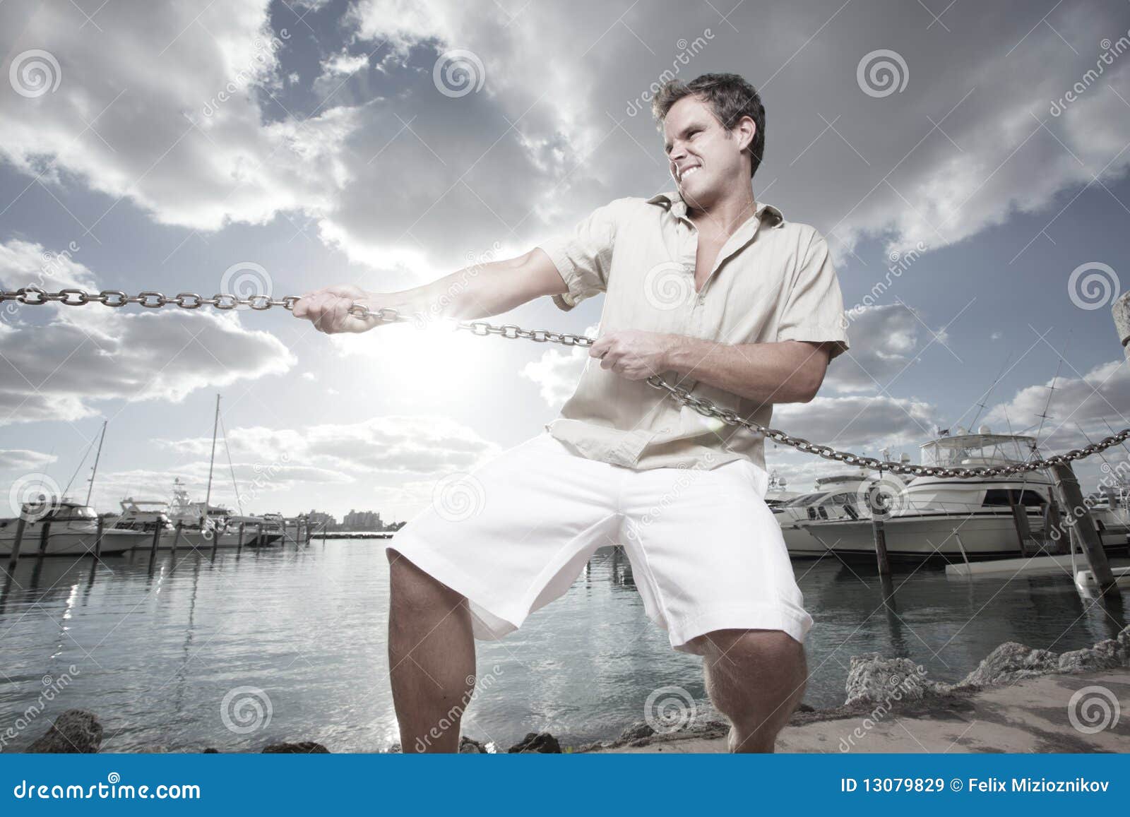 Man tugging on a chain stock image. Image of single, muscular - 13079829