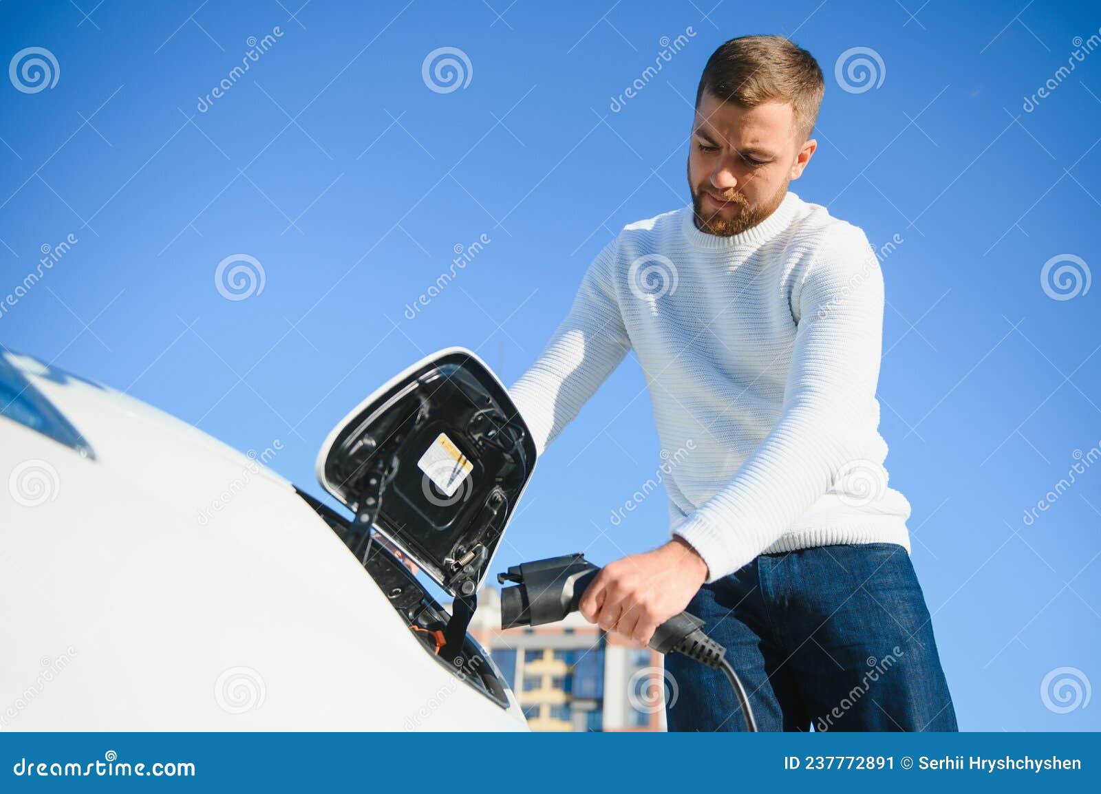 Man Turning on Charging of Car Stock Image - Image of renewable ...