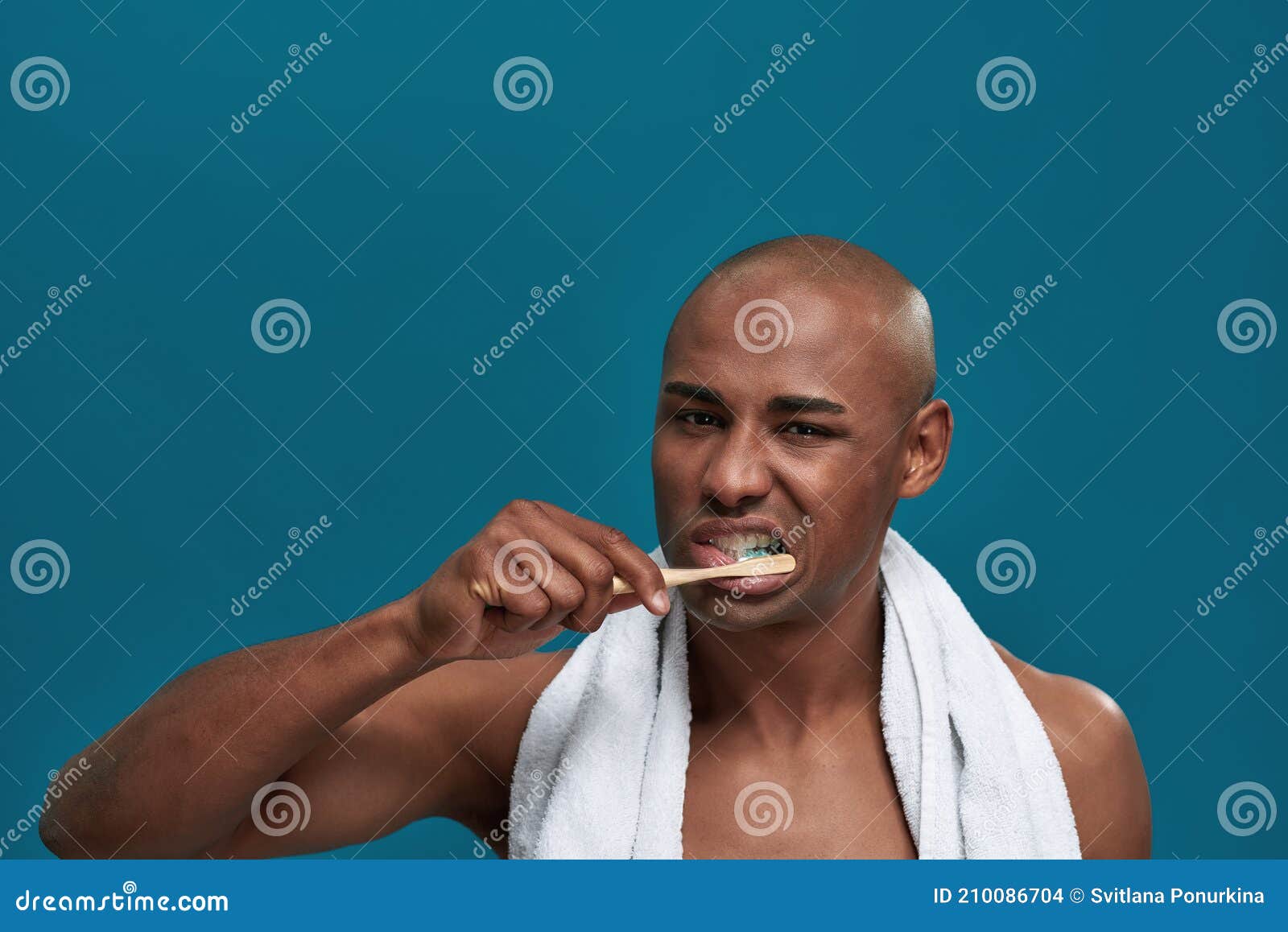 Mixed-race Person Pulling Down Lip with a Toothbrush Stock Photo ...