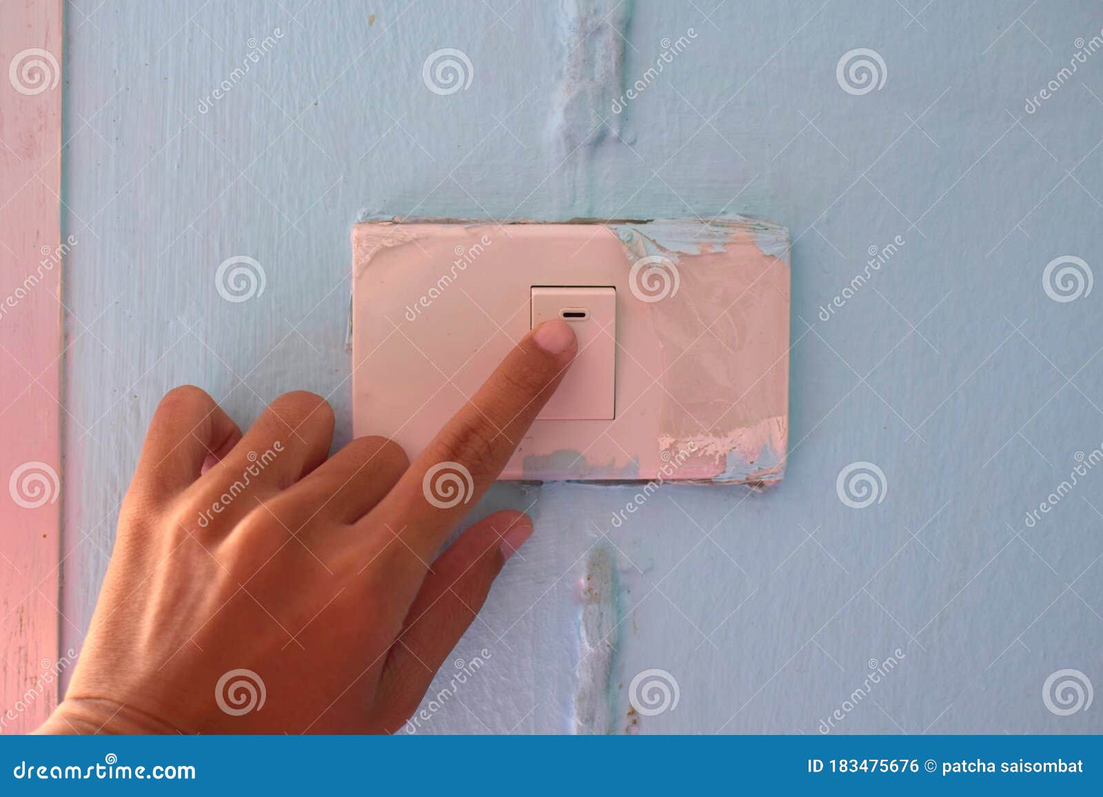 A Man Turning on the Light Switch in the Bedroom. Stock Photo - Image ...