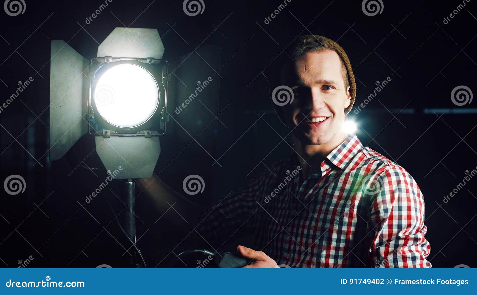 Man Turning on Studio Light Stock Photo - Image of switching, lamp ...