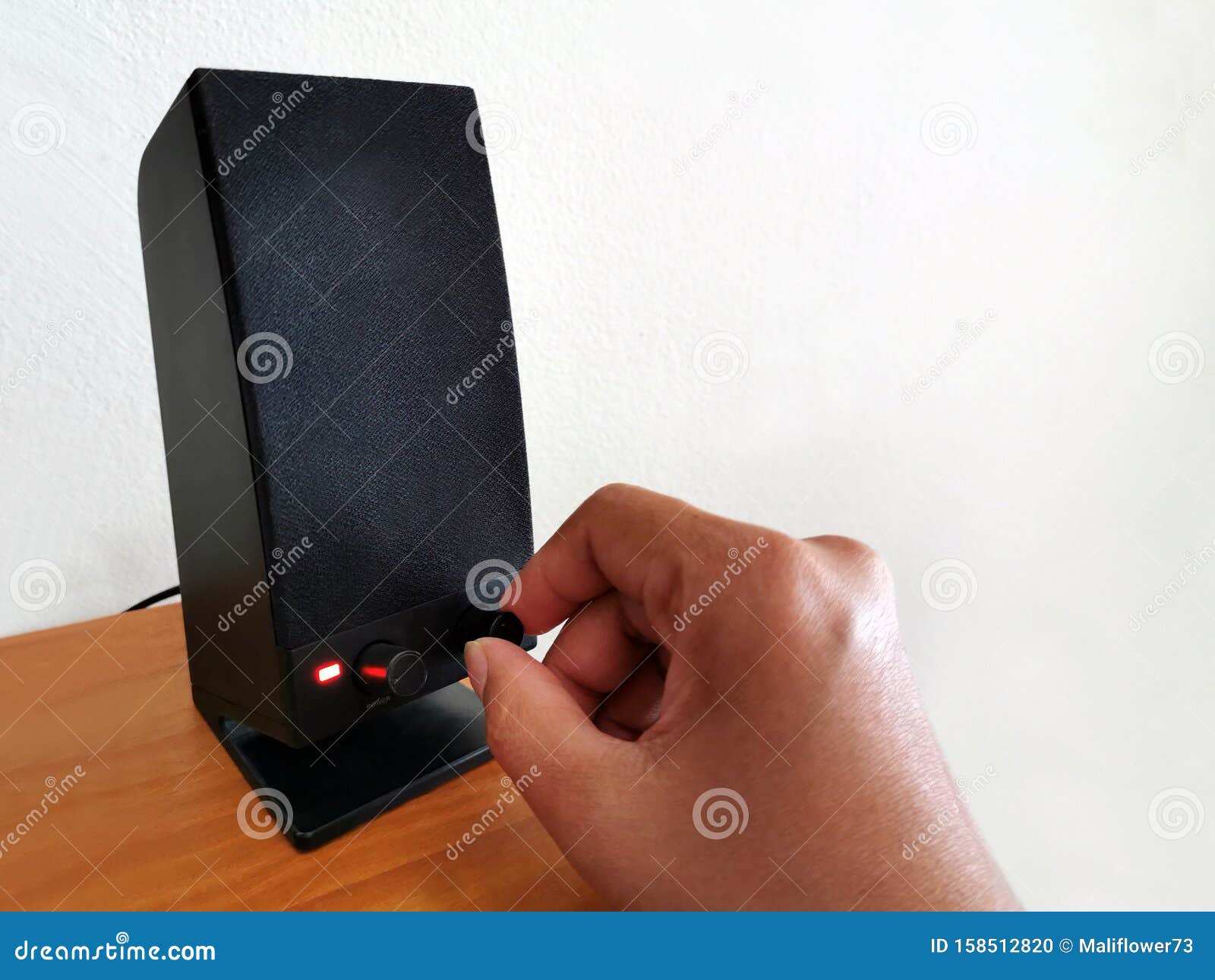 Man Turning the Volume Up on Desktop Computer Speaker. Stock Photo ...