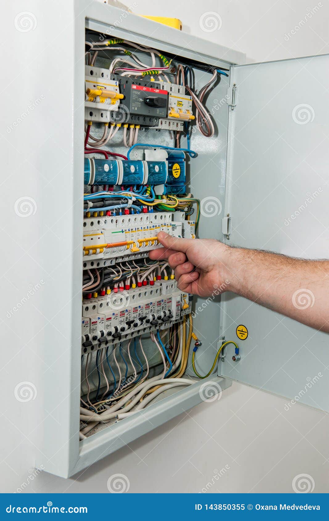 The Man Turns on the Electrical Switch on the Electrical Distribution ...