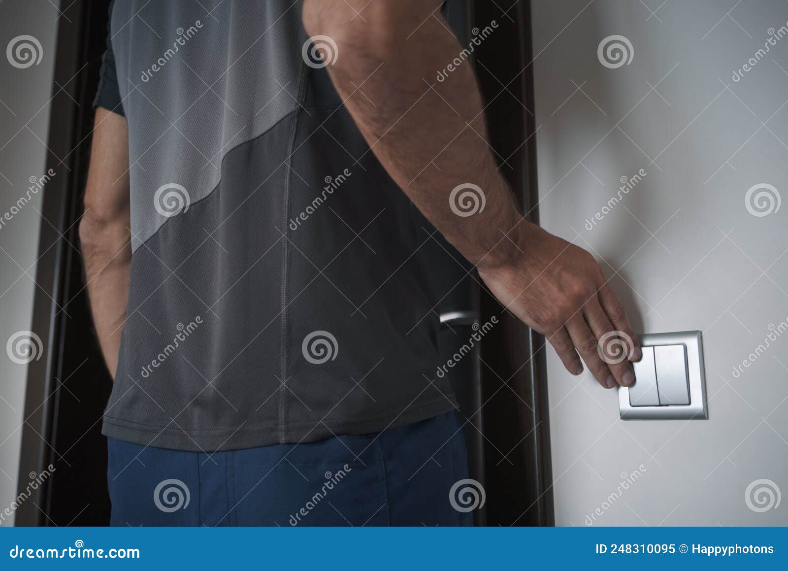 Man Turns Off the Light when Leaving the Room Stock Image - Image of ...