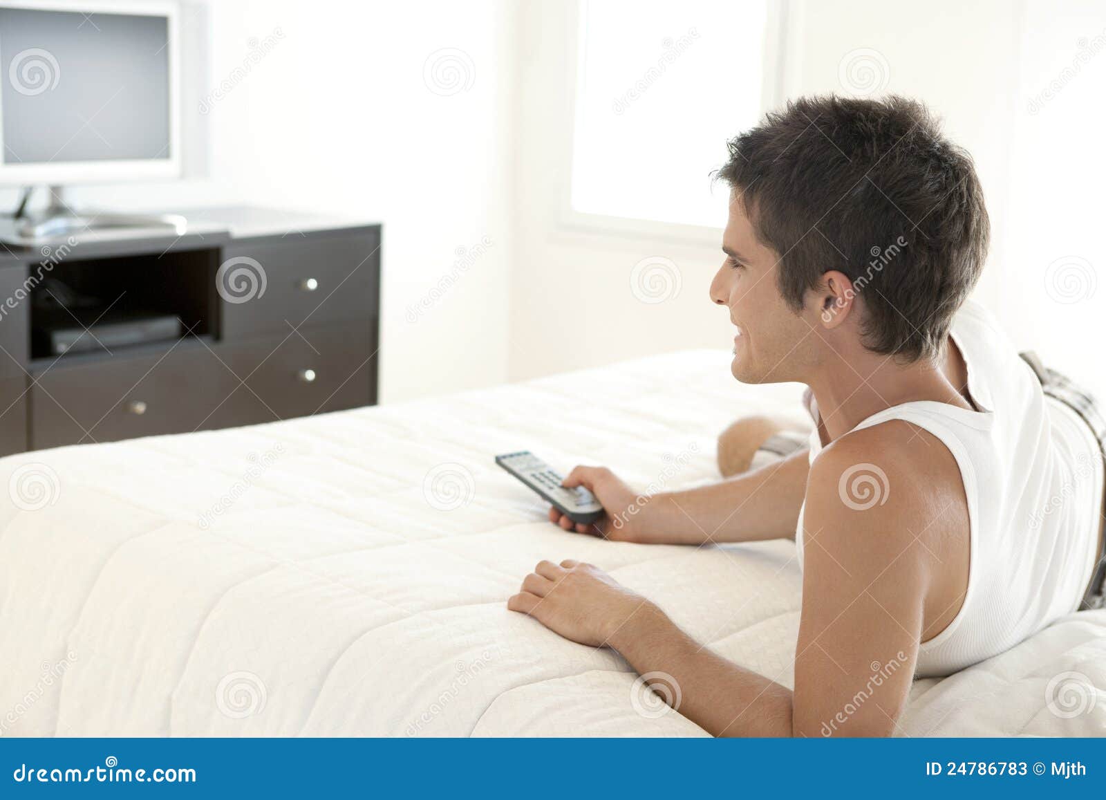 Man with TV in Hotel Room stock image. Image of male - 24786783