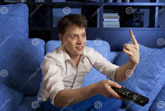 Man with Tv Remote Control at Home Stock Image - Image of living ...