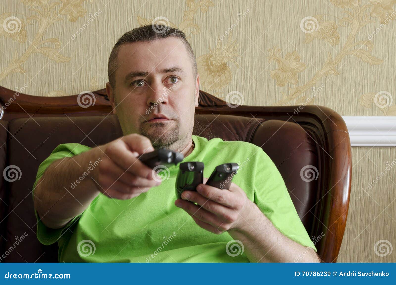 Man with a TV Remote Control Stock Image - Image of portrait ...