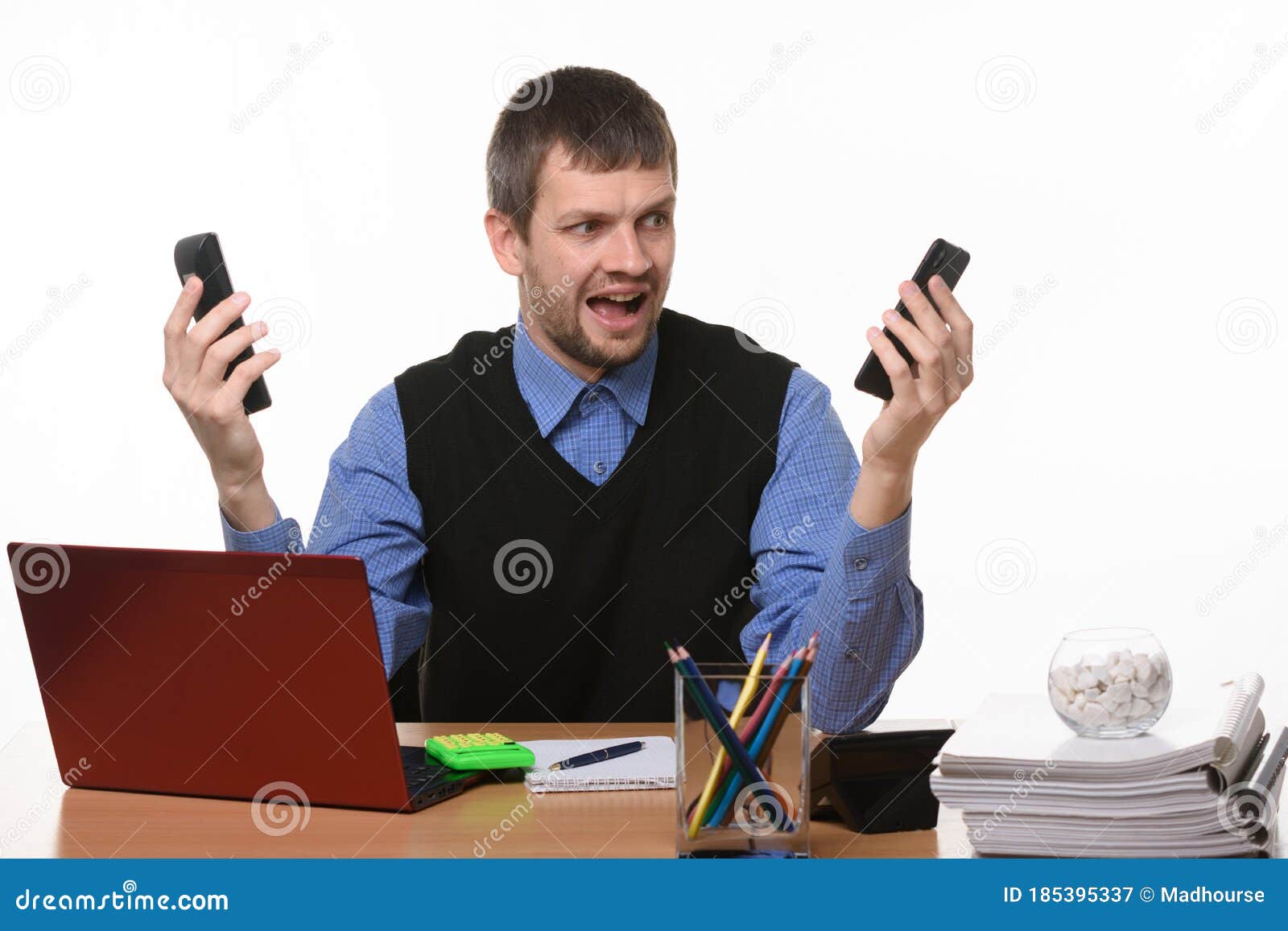 Man with Two Phones in Shock Looks at Them Stock Image - Image of ...