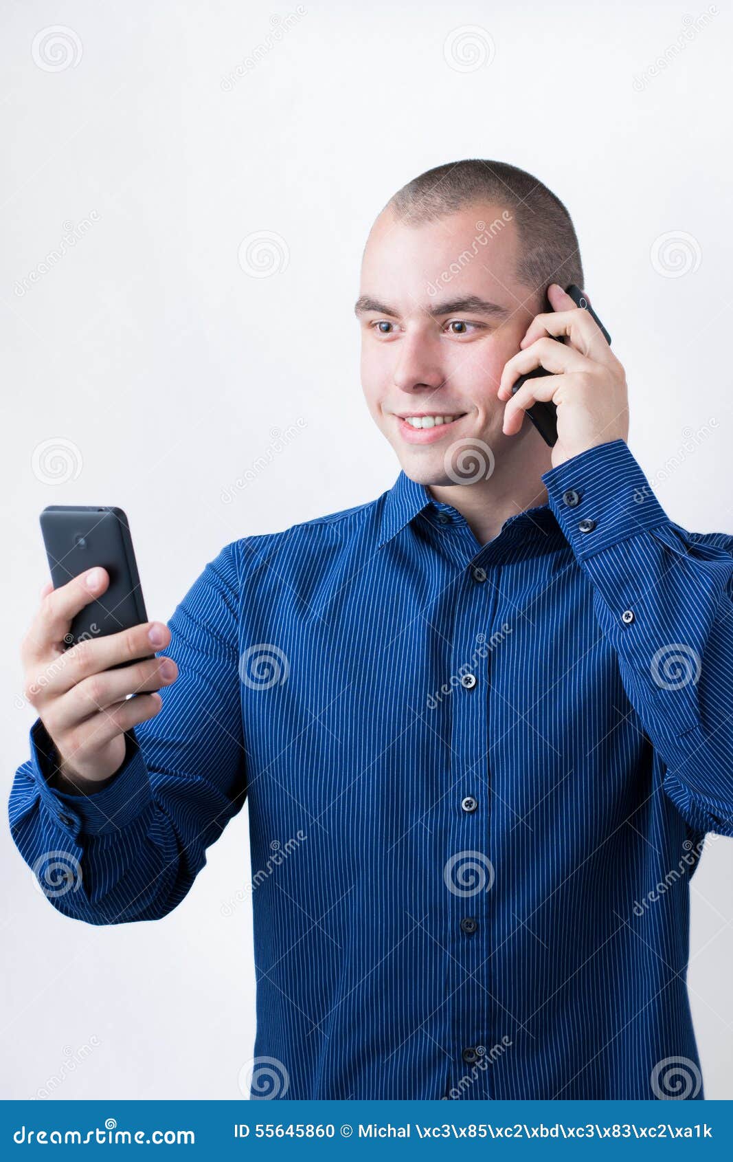 Man with two smart phones stock photo. Image of modern - 55645860