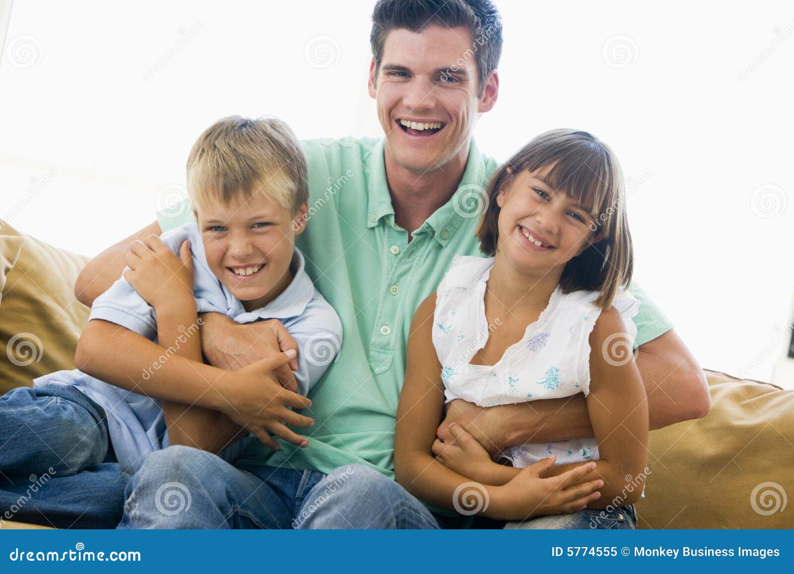 Man and Two Young Children in Living Room Smiling Stock Image - Image ...