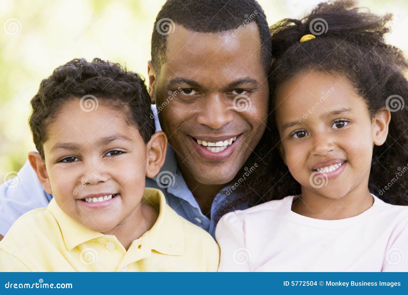 Man and Two Young Children Outdoors Smiling Stock Photo - Image of ...