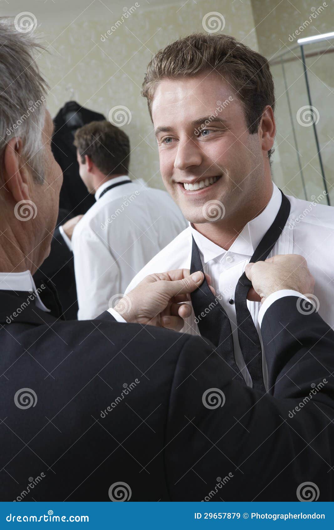Man Tying Groom s Bow Tie stock image. Image of ready - 29657879