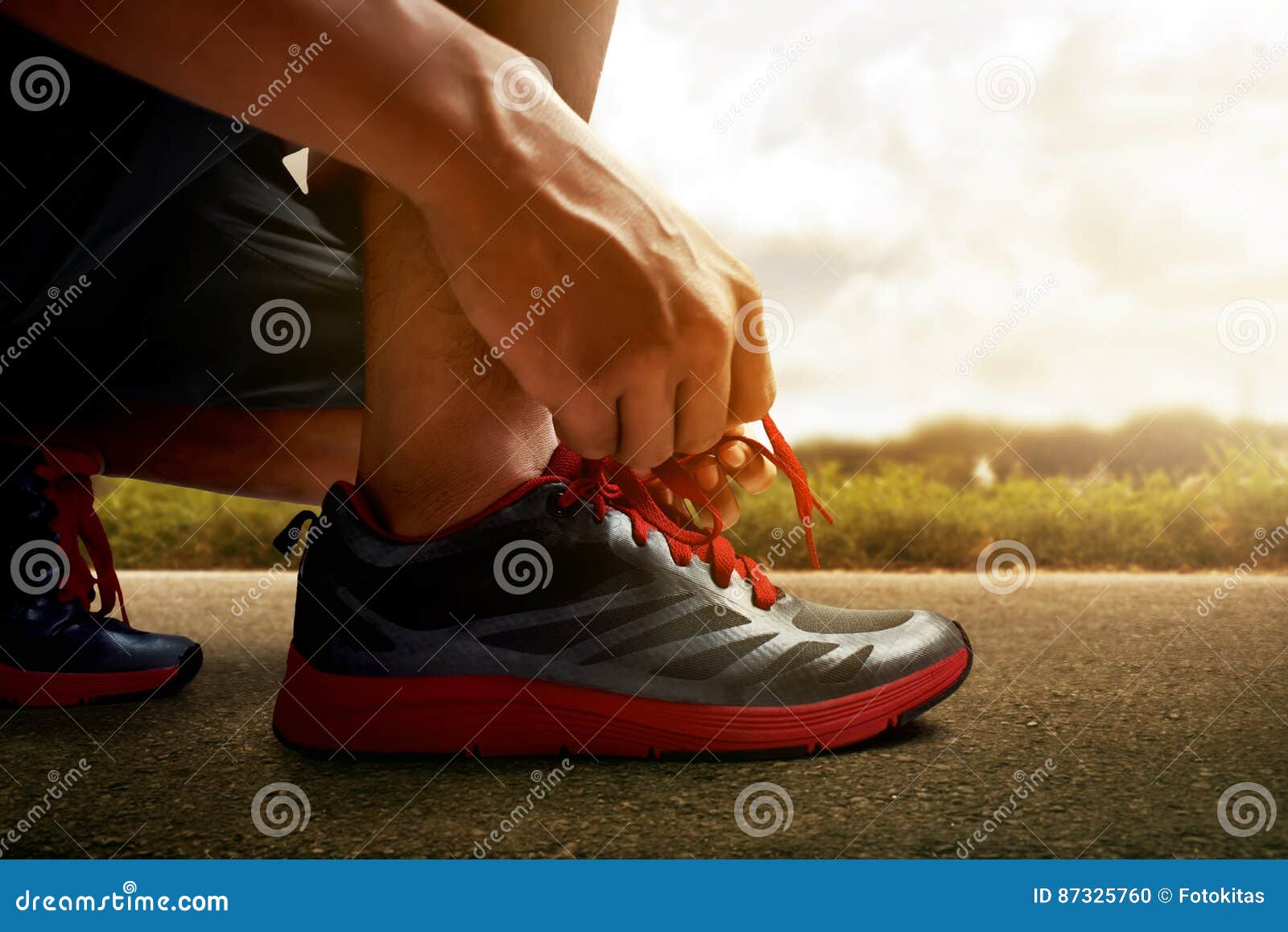 Man tying running shoes stock photo. Image of closeup - 87325760