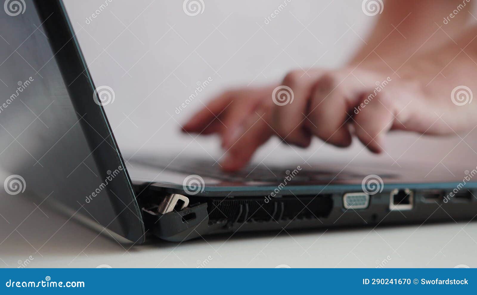 A Man Types on the Keyboard of a Broken Laptop. Broken Laptop Case ...