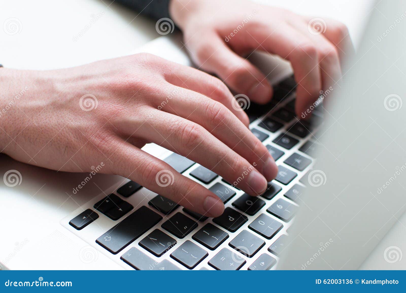 A man typing on his laptop stock photo. Image of keyboard - 62003136
