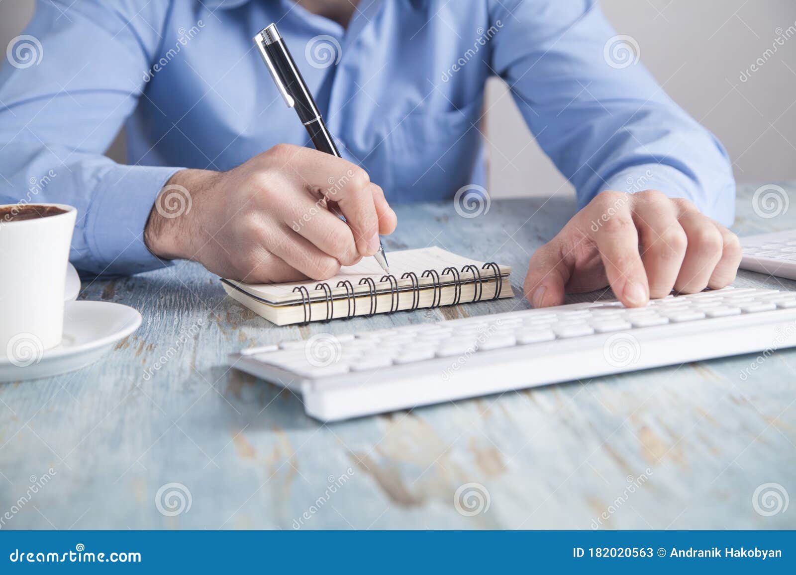 Man Typing in Keyboard and Writing on Notepad Stock Image - Image of ...