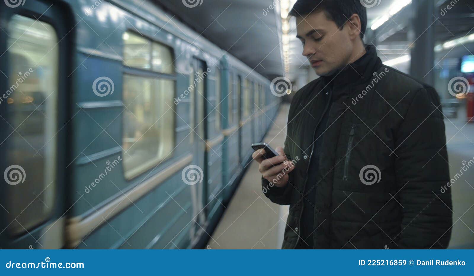 Man Typing Sms Standing on the Subway Platform Stock Image - Image of ...