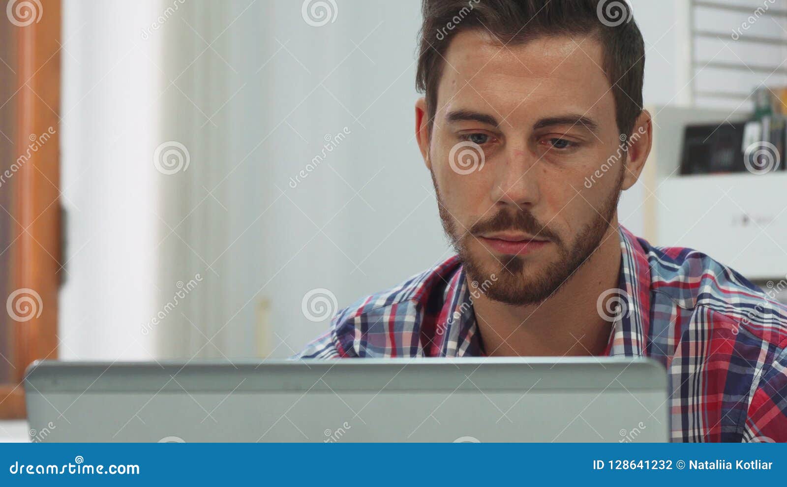A Serious Guy Type Something on the Keyboard on the Computer Stock ...