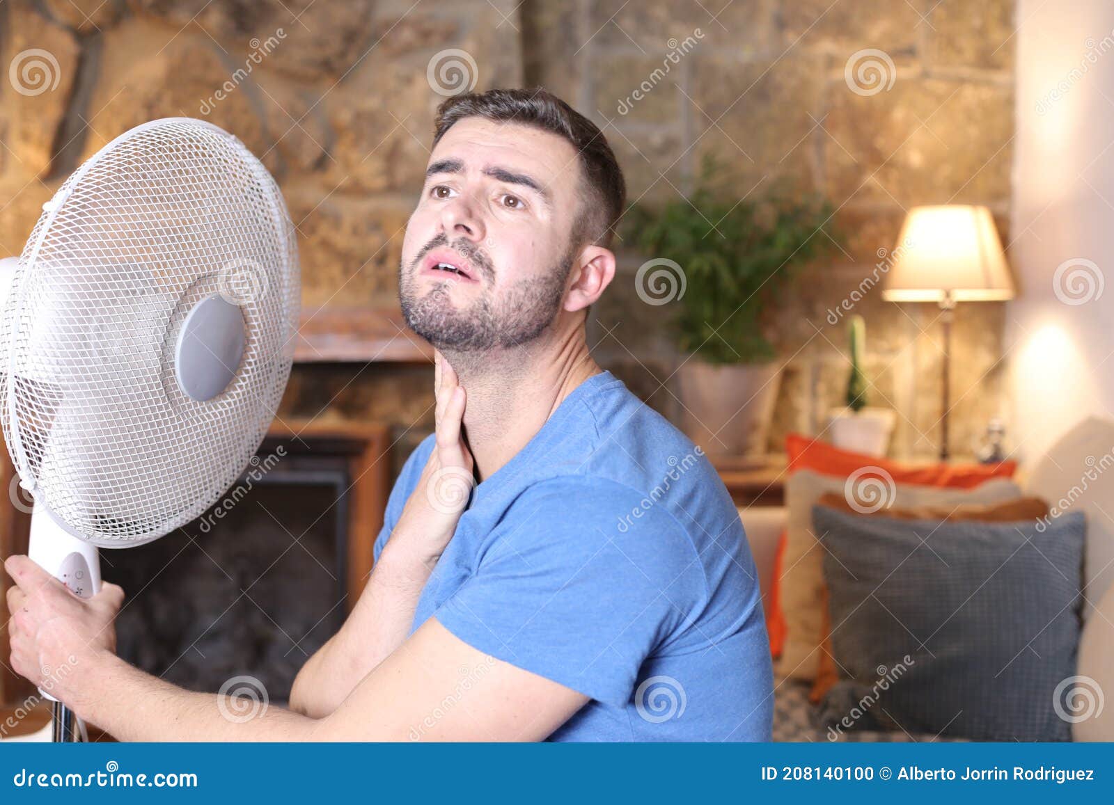 Man during Unbearable Heatwave Using Electric Fan Stock Photo - Image ...