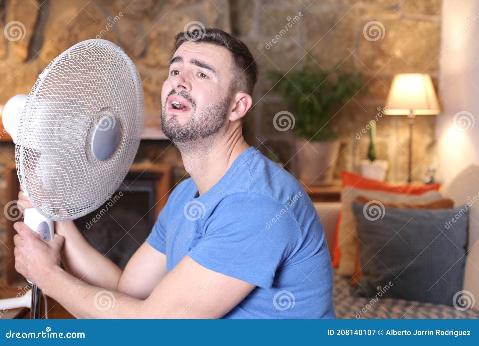 Man During Unbearable Heatwave Using Electric Fan Royalty-Free Stock ...