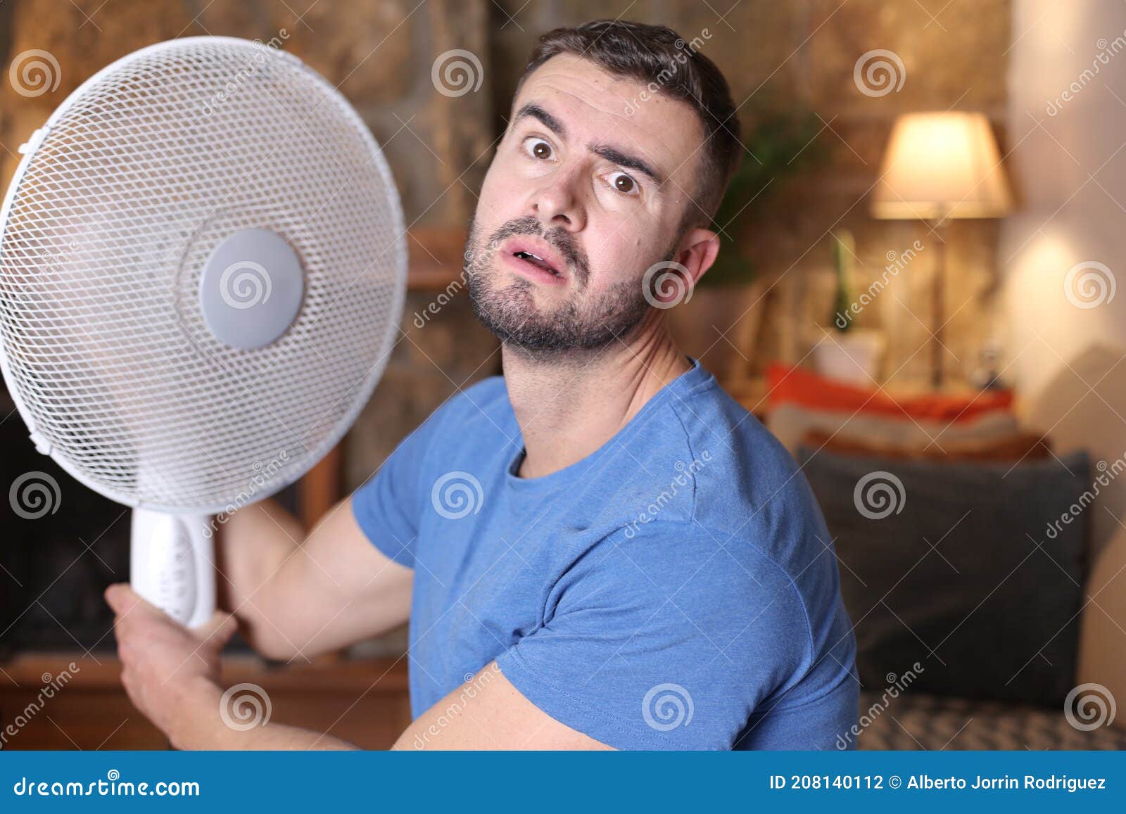 Man During Unbearable Heatwave Using Electric Fan Royalty-Free Stock ...