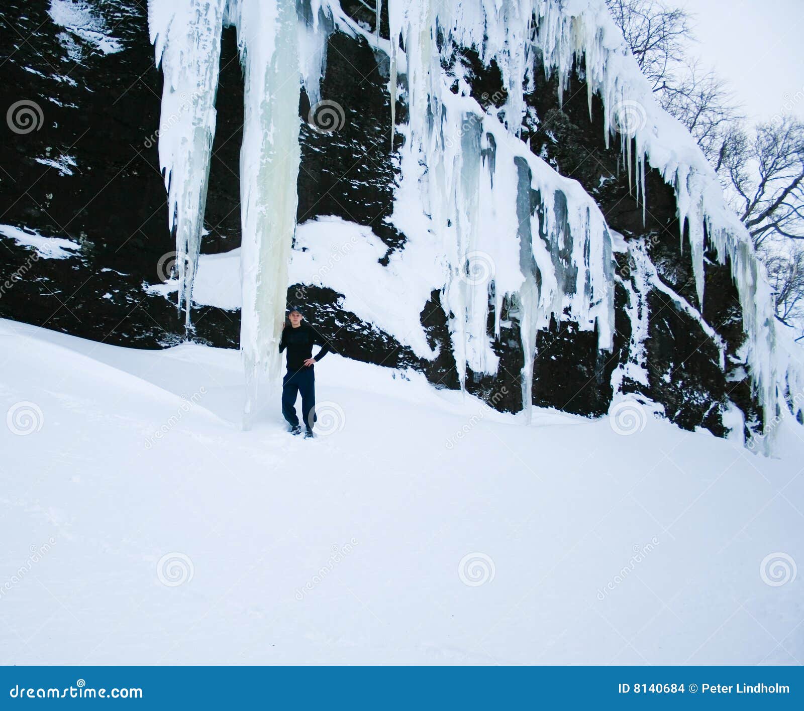 Man under gigantic icicles stock photo. Image of frozen - 8140684