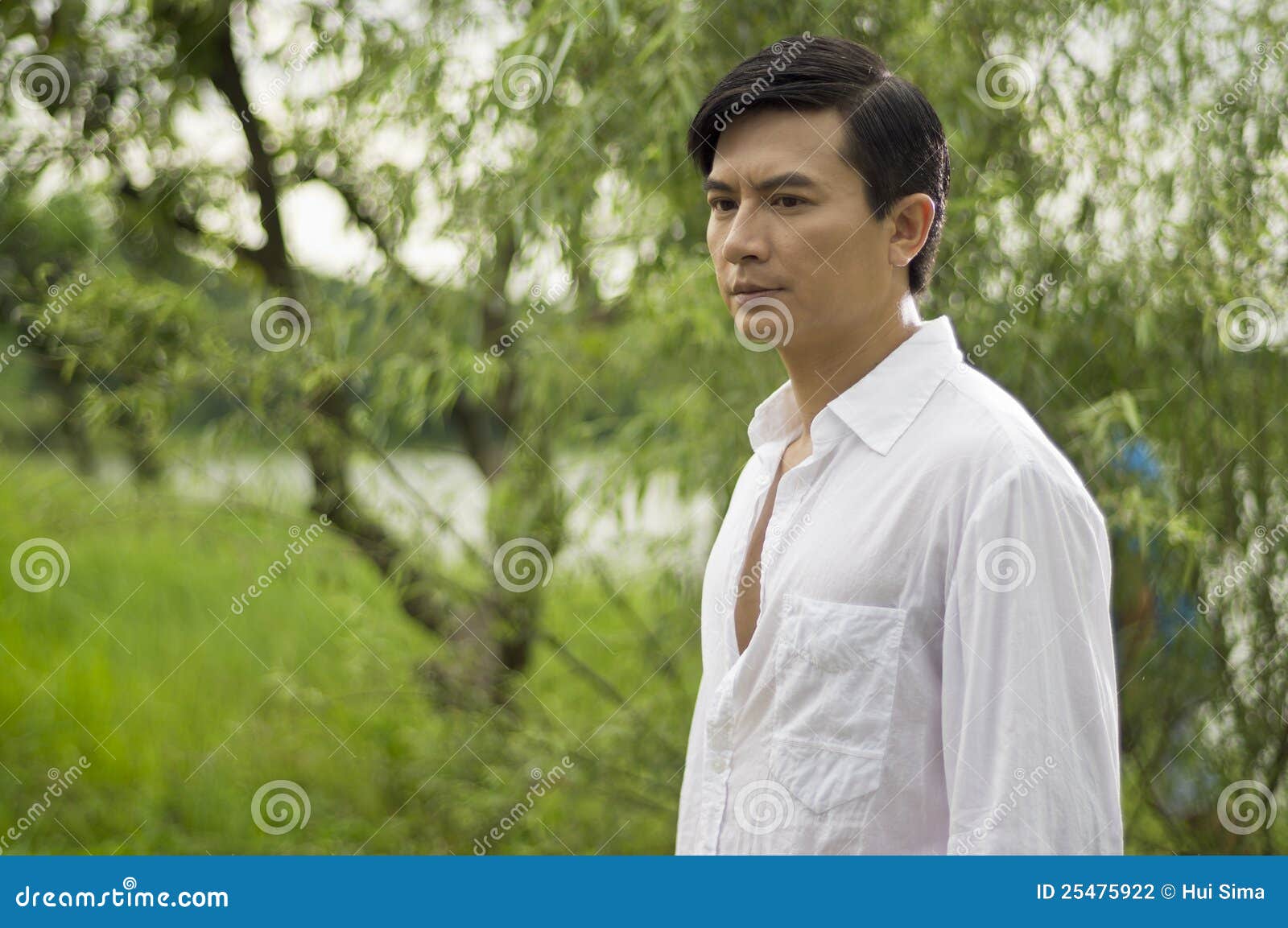 Man under green tree stock photo. Image of mature, serene - 25475922