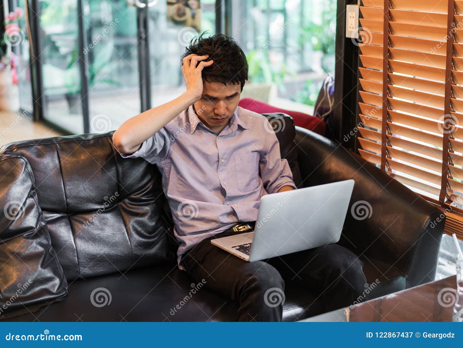 Man Under a Lot of Stress Using Laptop Computer in Cafe Stock Image ...