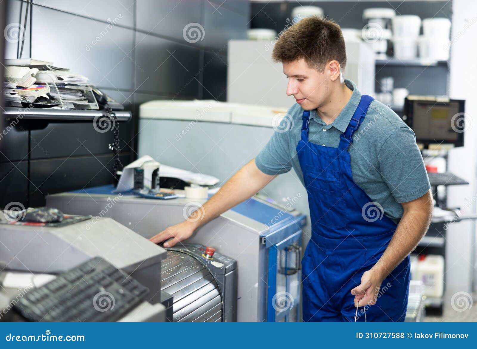 Man in Uniform Operating Computerised Machne To Mix Paint Stock Photo ...