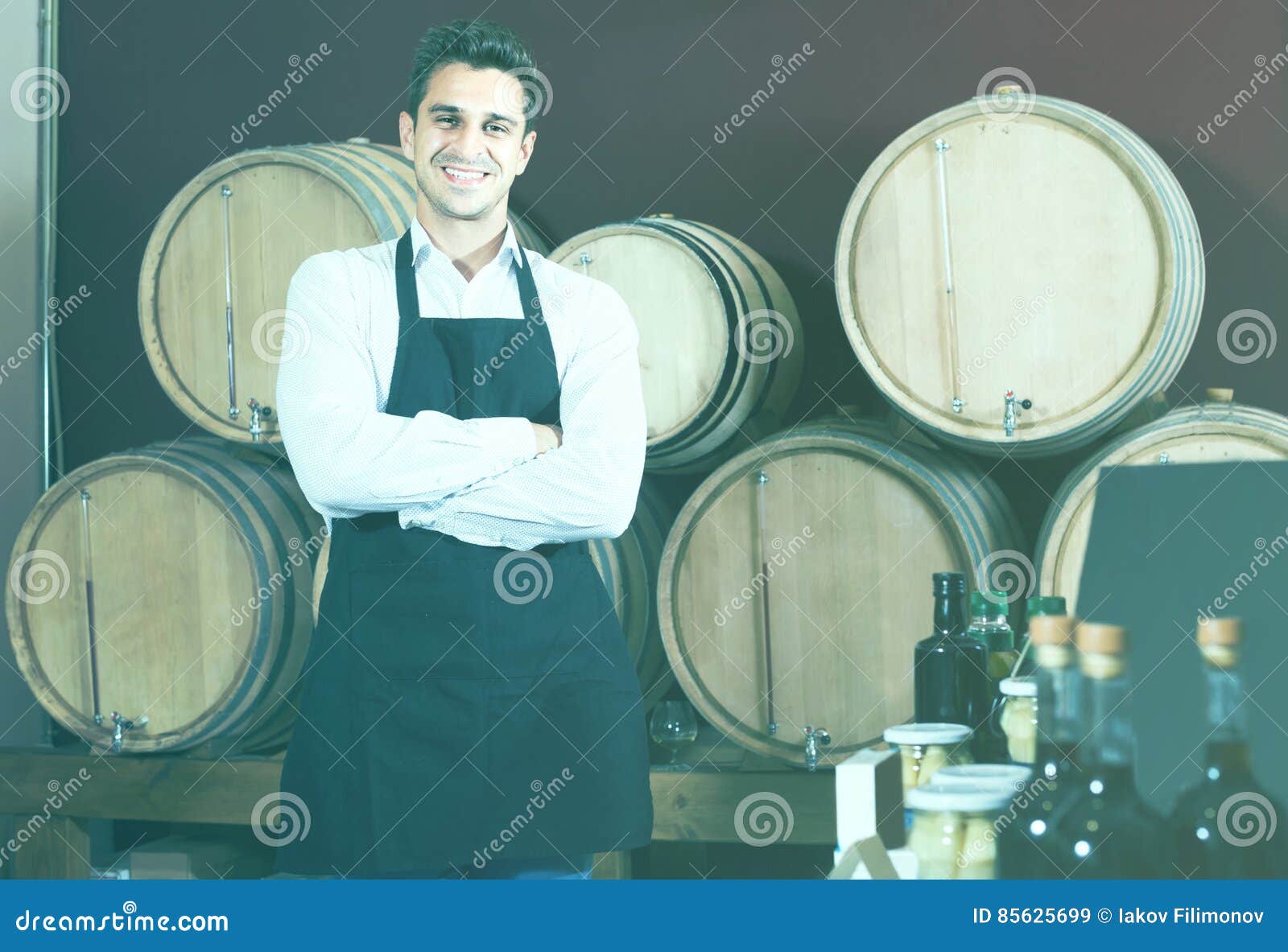 Man in Uniform Standing in Store Wine Section with Woods Stock Image ...