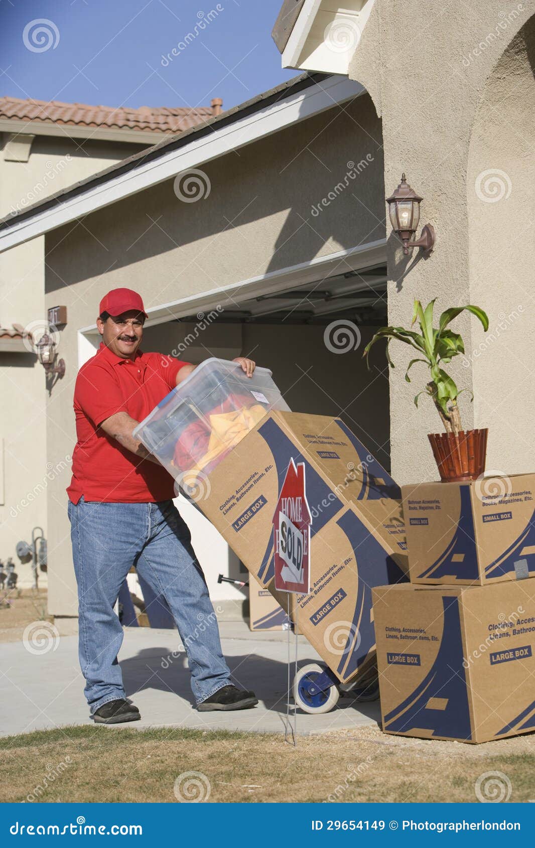 Man Unloading Boxes in Front of New House Stock Image - Image of ...