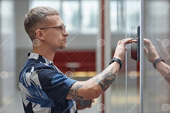Man Unlocking Office Room with Access Code Indoors Using Smart Wireless ...
