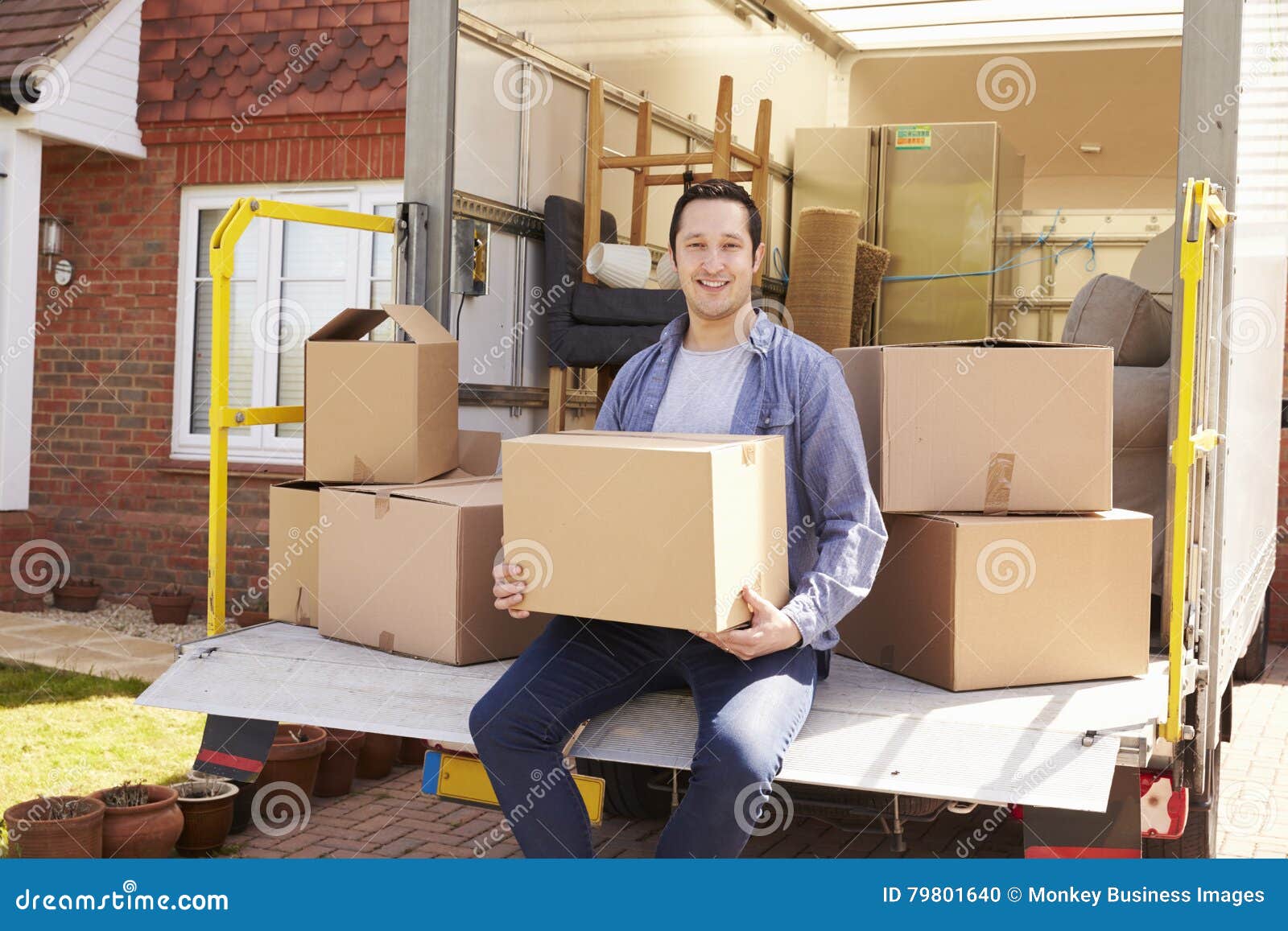 Man Unpacking Moving in Boxes from Removal Truck Stock Photo - Image of ...