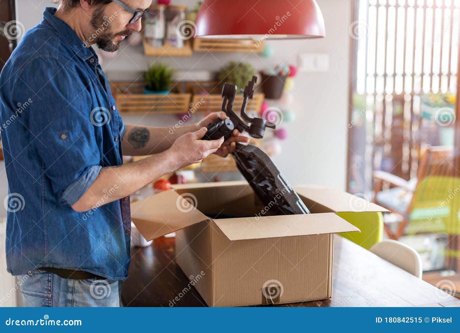 Man Unpacking Parcel with Tools Ordered Online Stock Image - Image of ...