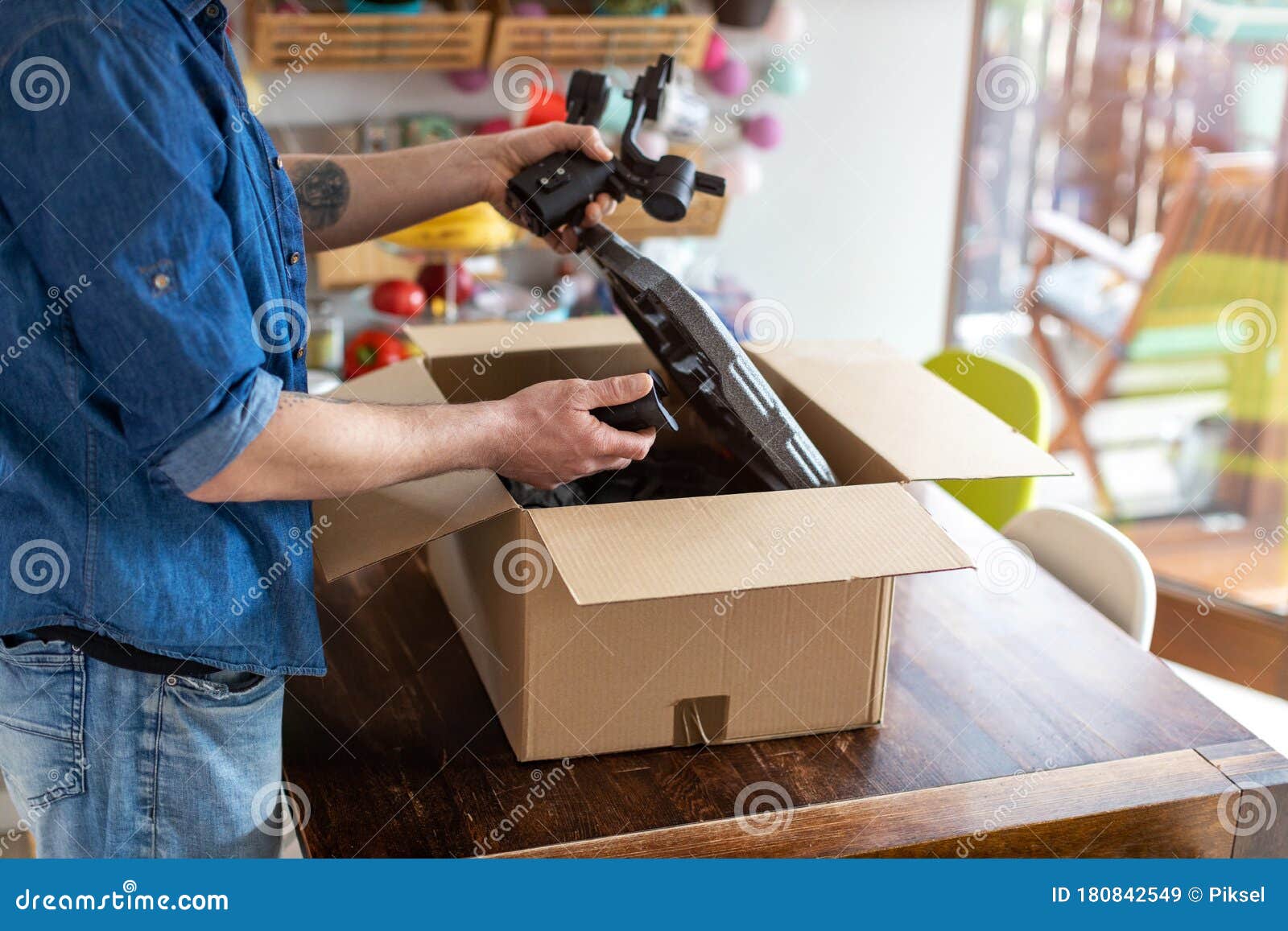 Man Unpacking Parcel with Tools Ordered Online Stock Image - Image of ...