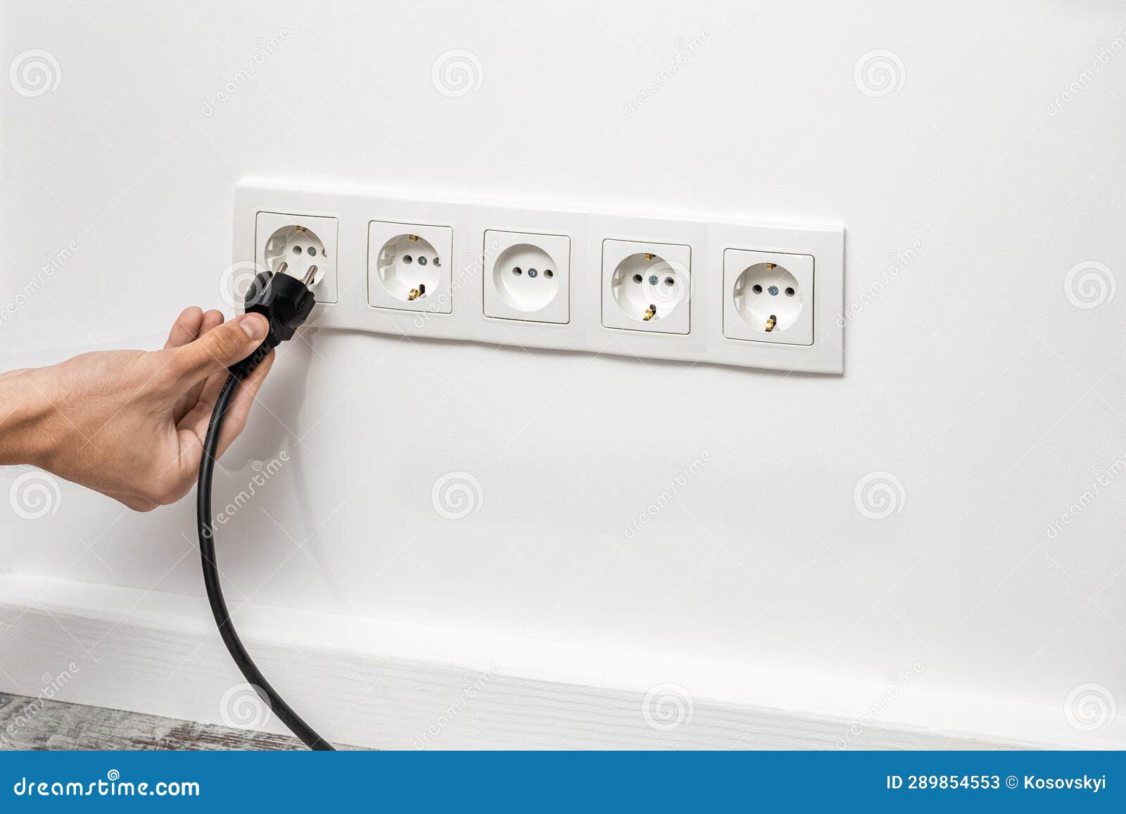 Man Unplugging Cord from a Electrical Outlet Stock Image - Image of ...