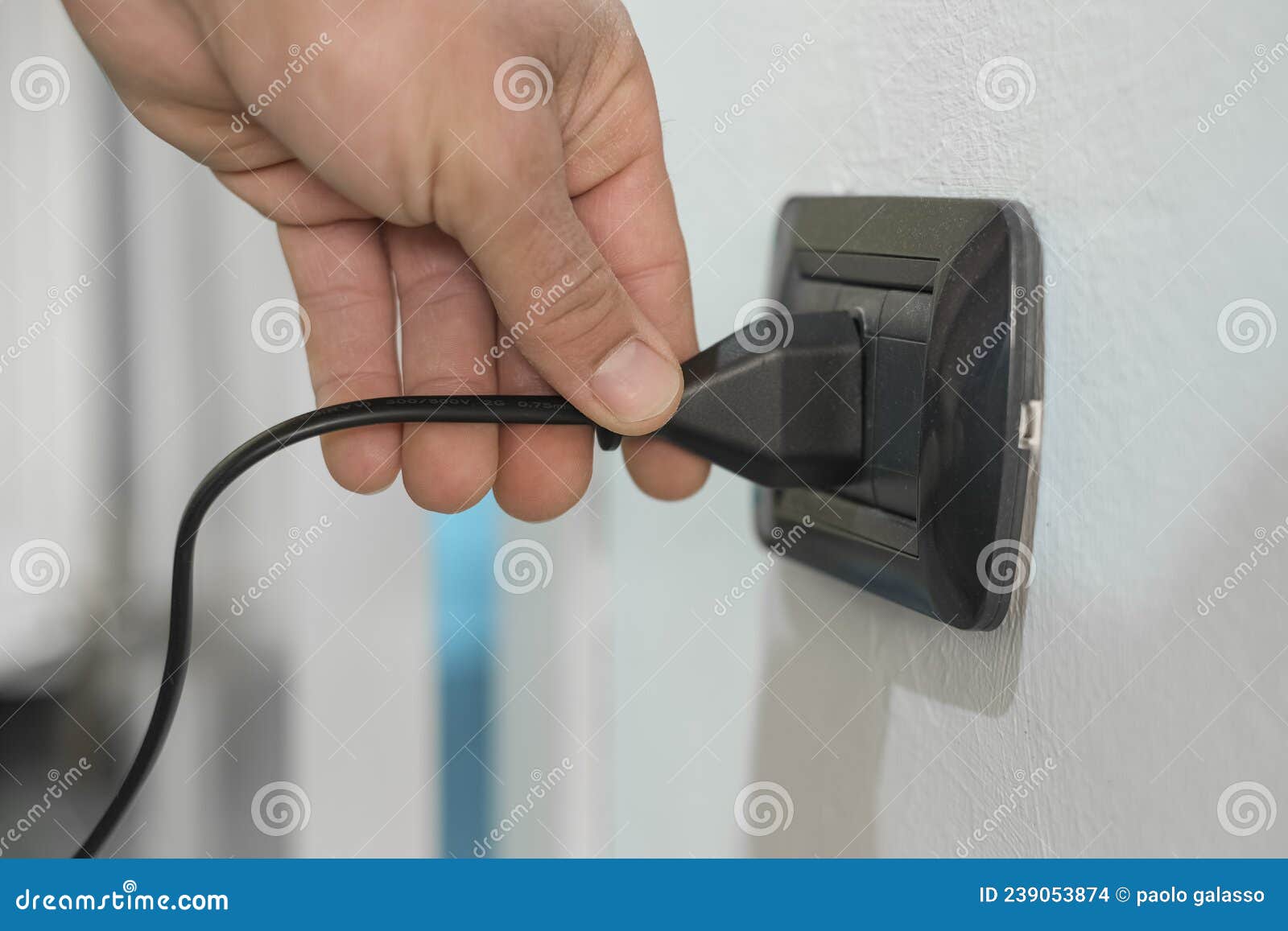 Man Unplugging Electronic Device in Wall Power Plug Socket at Home ...