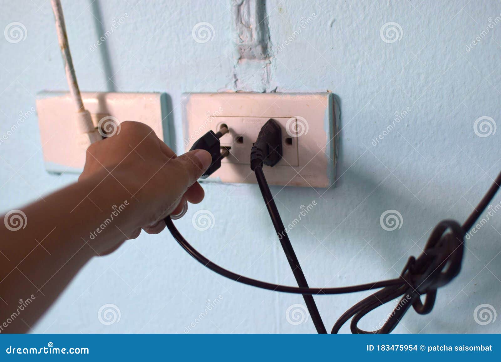A Man Unplugging the TV in the Bedroom. Stock Photo - Image of iron ...