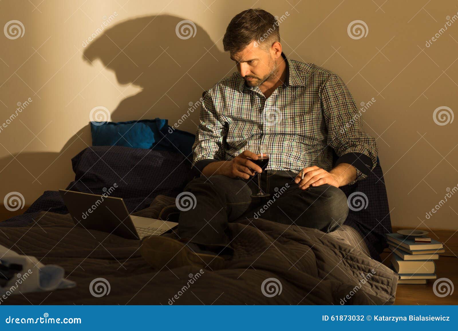Man in untidy bed stock photo. Image of drinking, portrait - 61873032