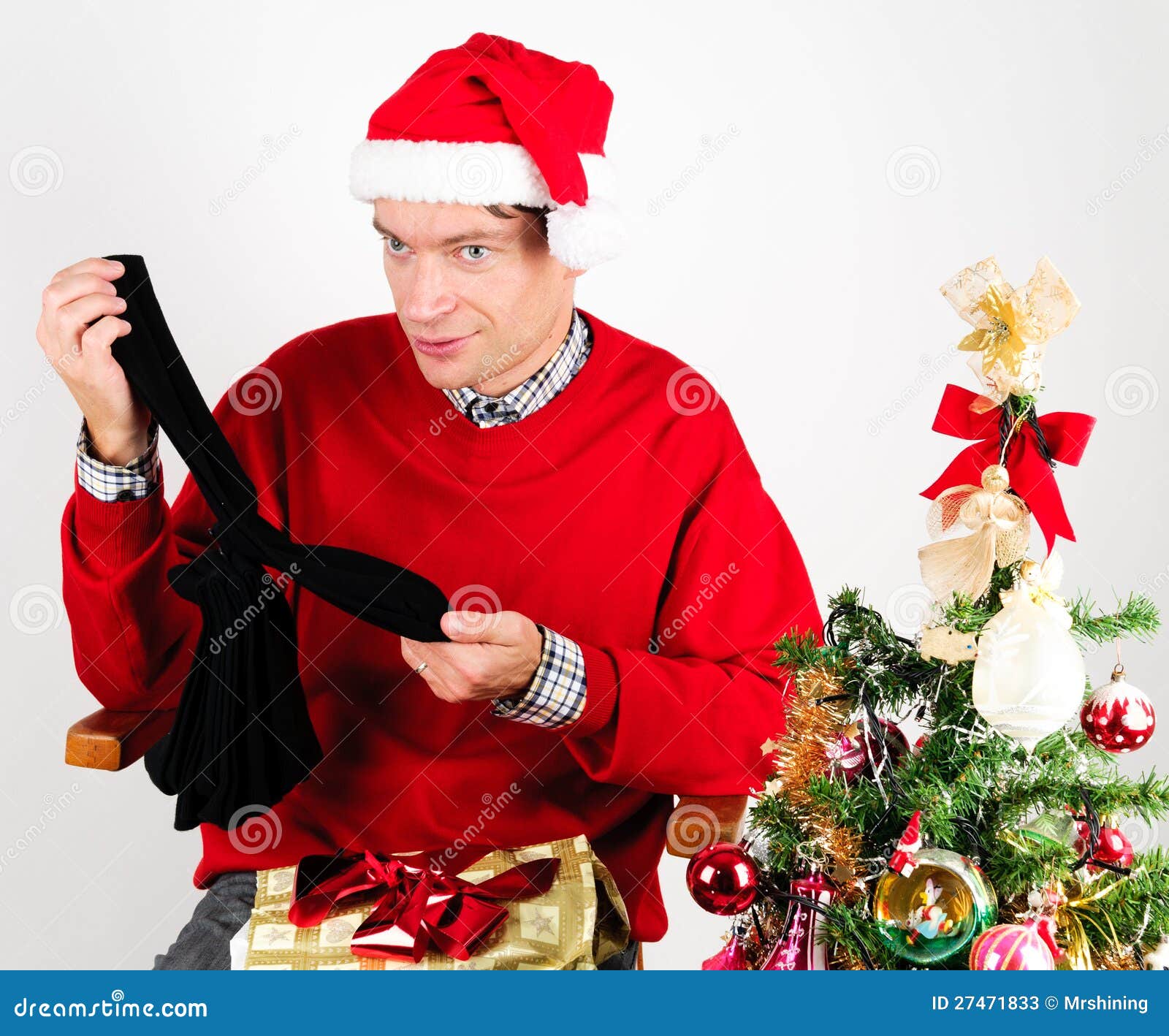 Man Unwrapping a Christmas Gift Stock Image - Image of decoration ...