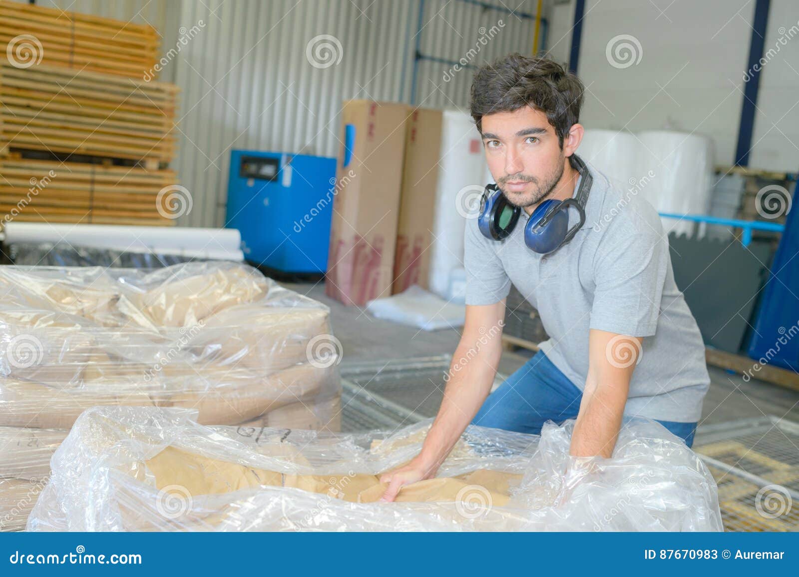 Man Unwrapping Plastic from Pallet Bags Stock Image - Image of produce ...